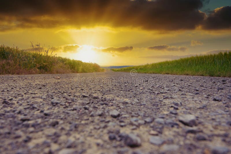 Field Path To a Sunset on a Cloudy Sky Stock Photo - Image of ...
