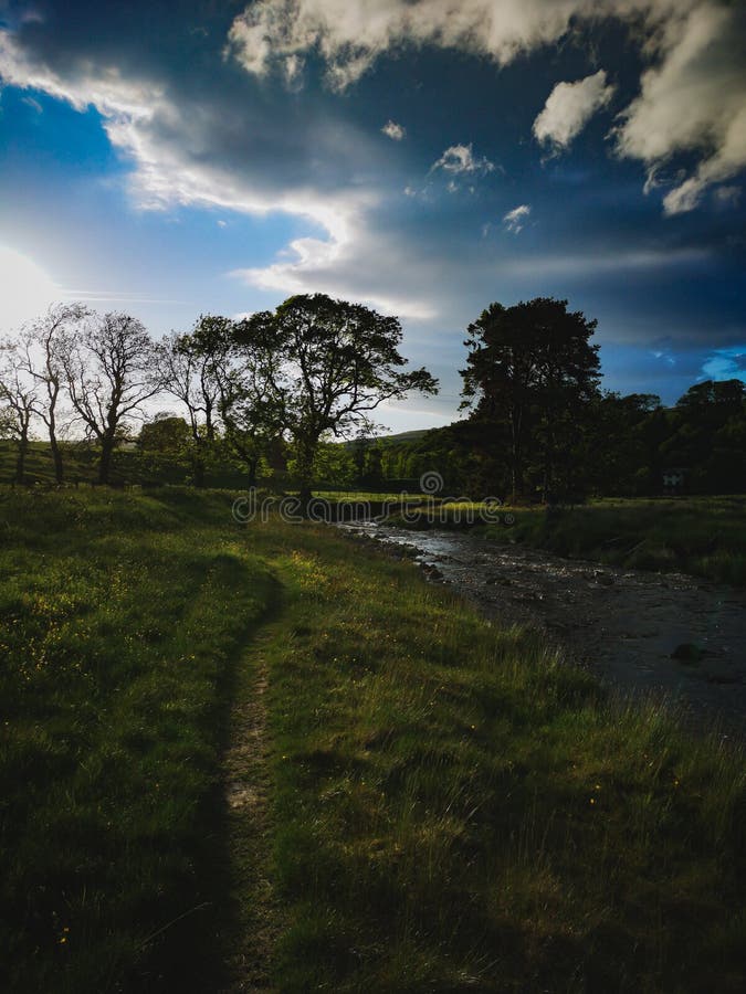 Field with Pathway Next To River Stock Image - Image of next, pathway ...