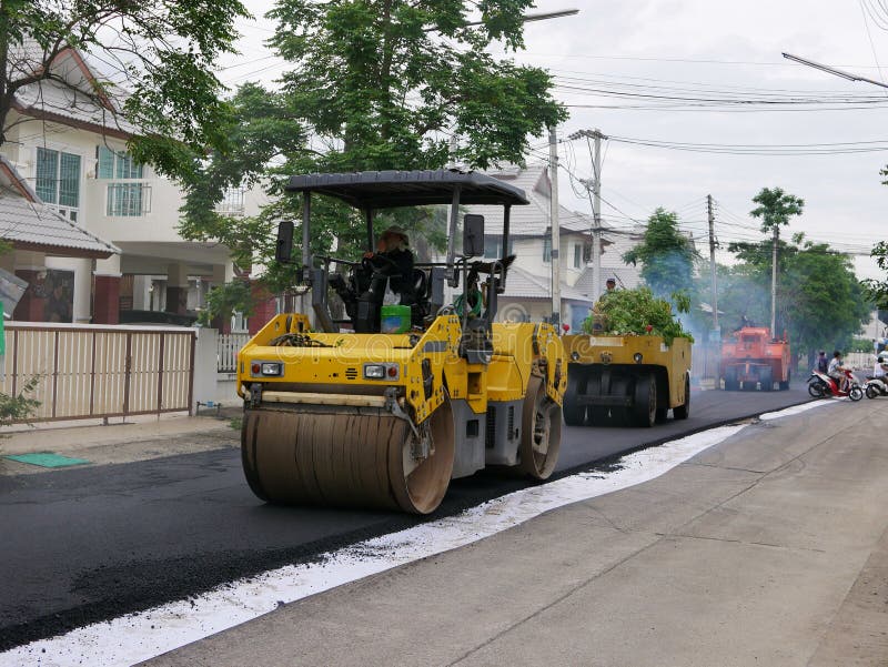 Road Rollers Moving on a Hot Asphalt Road Repairing the Road Surface ...