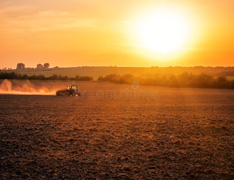 Field, tractor and sunset stock image. Image of environment - 154509193