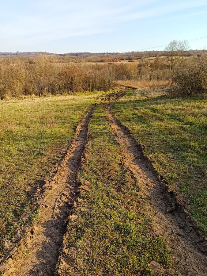 A Field Trail Made by Tractor Tires in the Mud Stock Image - Image of ...