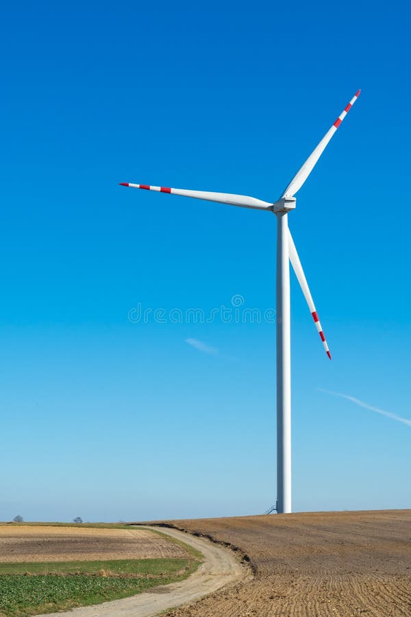 Field with Windmills for Electric Power. Clean Energy Produced by the ...
