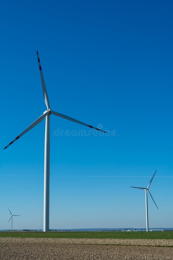 Field with Windmills for Electric Power. Clean Energy Produced by the ...