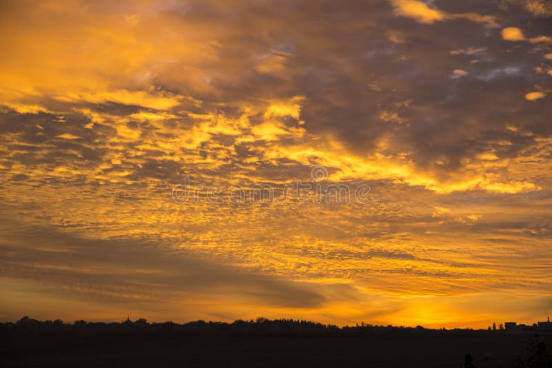 Fiery clouds at sunset stock photo. Image of natural - 62359026