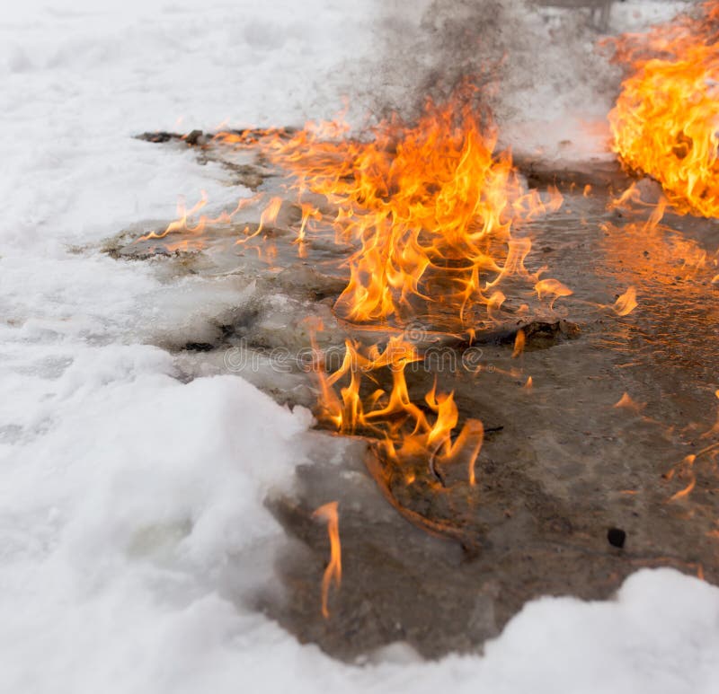 Fiery Flame on the White Snow in Winter Stock Image - Image of ...