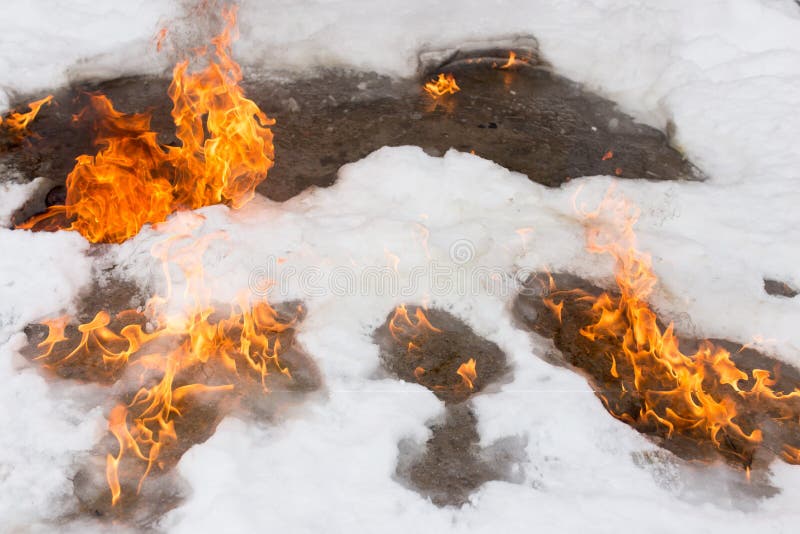 Fiery Flame on the White Snow in Winter Stock Photo - Image of spark ...