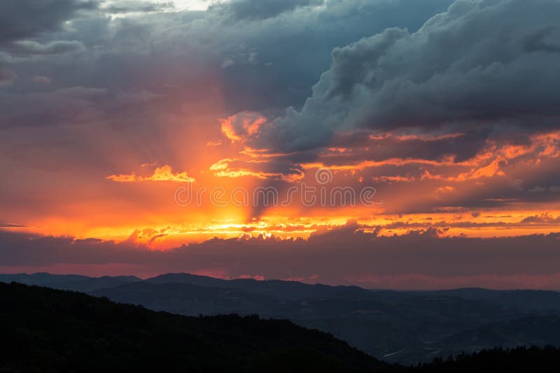 Fiery Red Sunset in the Clouds Stock Photo - Image of mountain, light ...