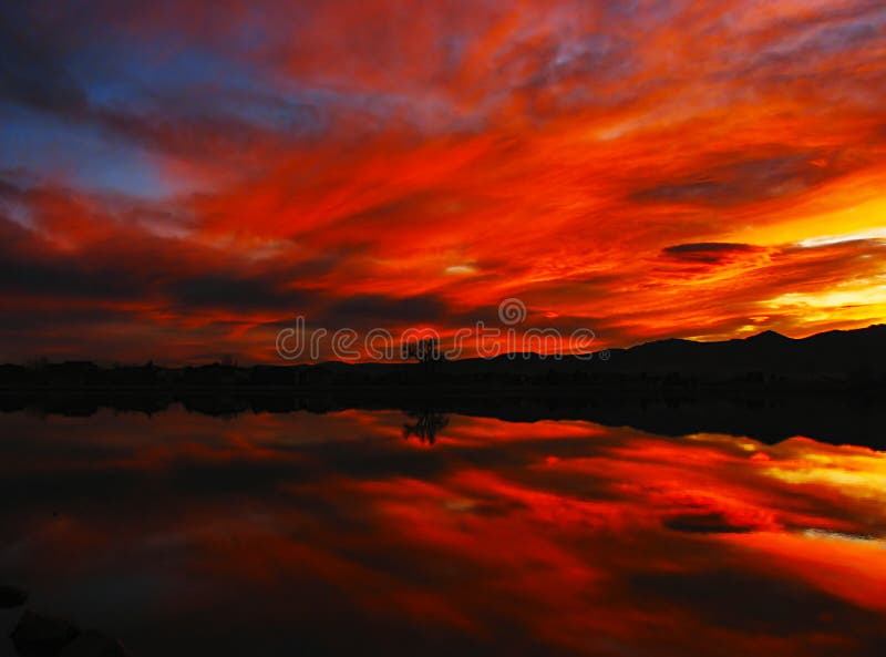 Fiery Red Sunset Reflection Stock Image - Image of yellow, breathtaking ...