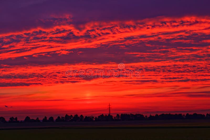 Fiery Red Cloud-covered Sky Glowing by Sunset in the Countryside Stock ...