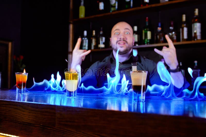 Fiery Show at the Bar. the Bartender Makes Hot Alcoholic Cocktail and ...