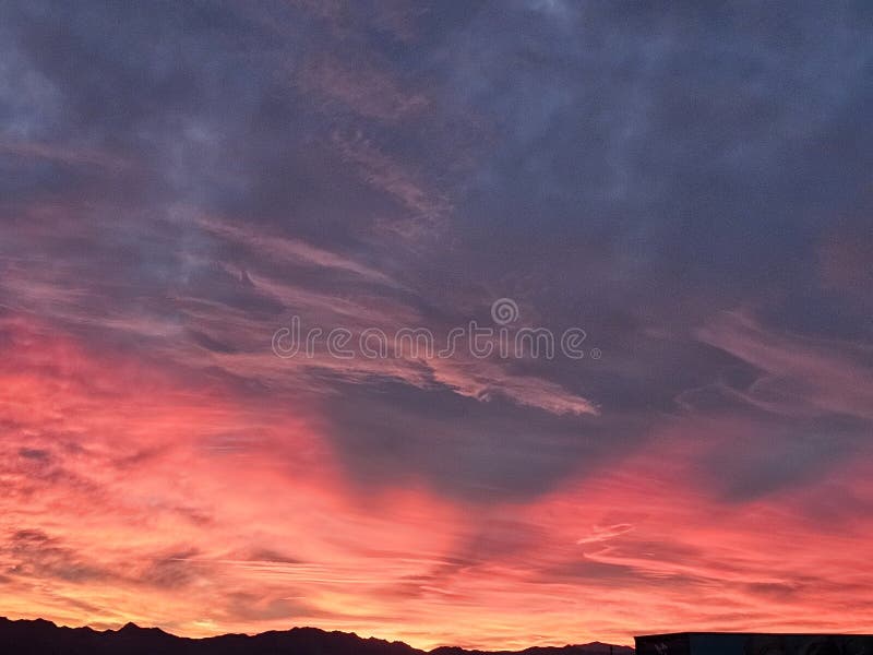 Fiery Sunset with Dark Looking Smokey Clouds! Stock Photo - Image of ...