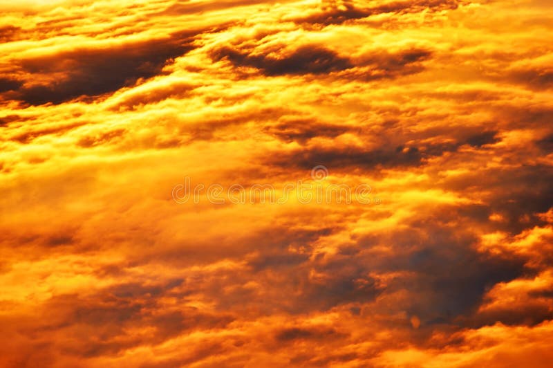 Fiery Sunset. Orange-yellow Clouds in the Summer at Sunset Stock Photo ...