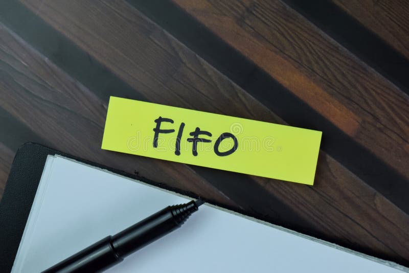 FIFO Write on Sticky Notes Isolated on Wooden Table Stock Photo - Image ...