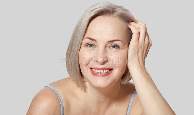 Fifty Year Old Woman Is Very Pleased With Her Well Groomed Face Relaxed