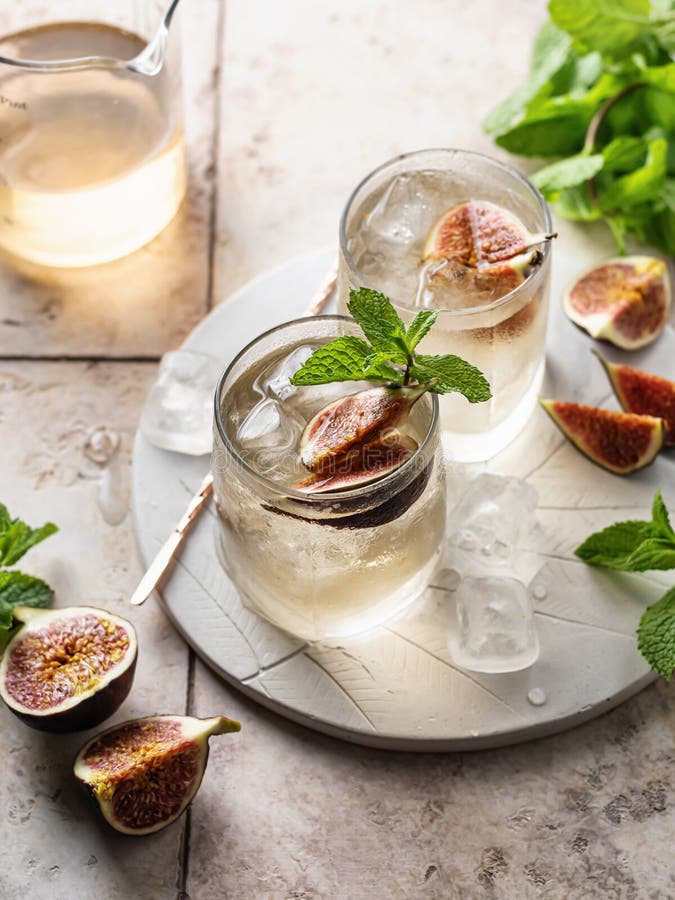 Fig Iced Cocktail with Mint on Tile Background. Infused Fig Water Stock ...