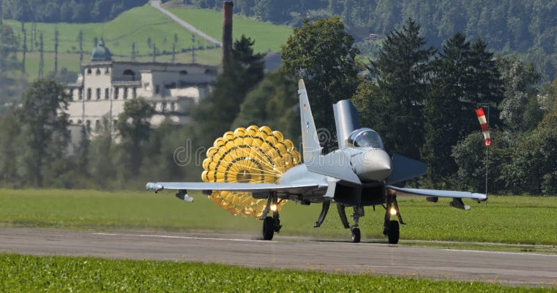 Fighter Jet Landing with Brake Parachute in Mountain Air Base. Copy ...