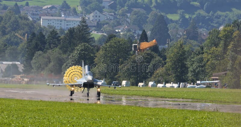 Fighter Jet Landing with Brake Parachute in Mountain Air Base. Copy ...