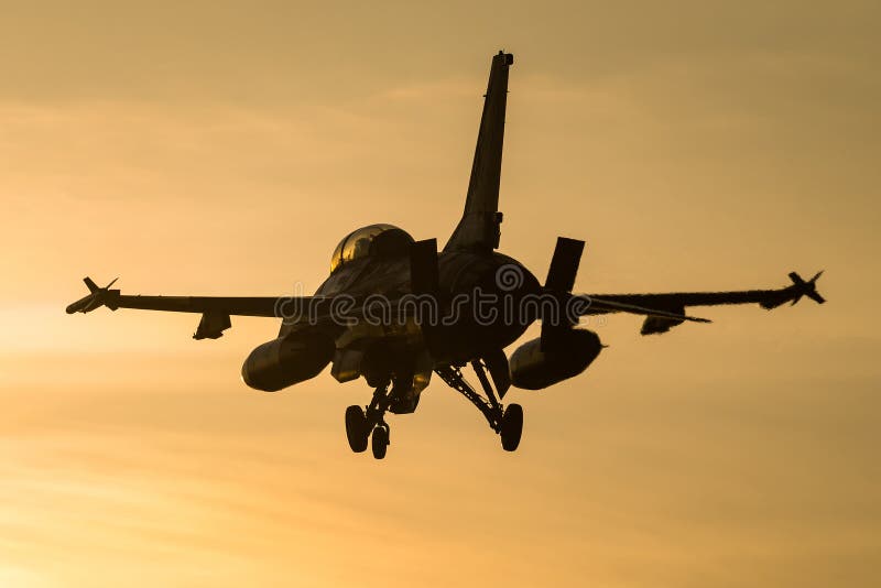 Fighter Jet Landing at Sunset Stock Image - Image of orange, aircraft ...