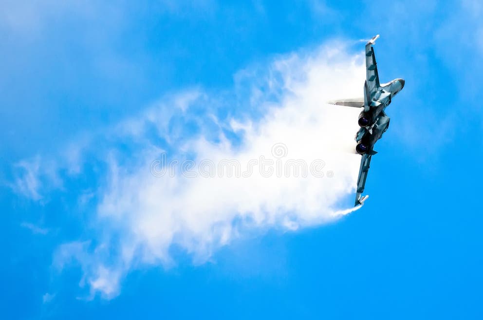 Fighter Jet Leaves a Trail in the Sky Clouds Breaking Stock Photo ...