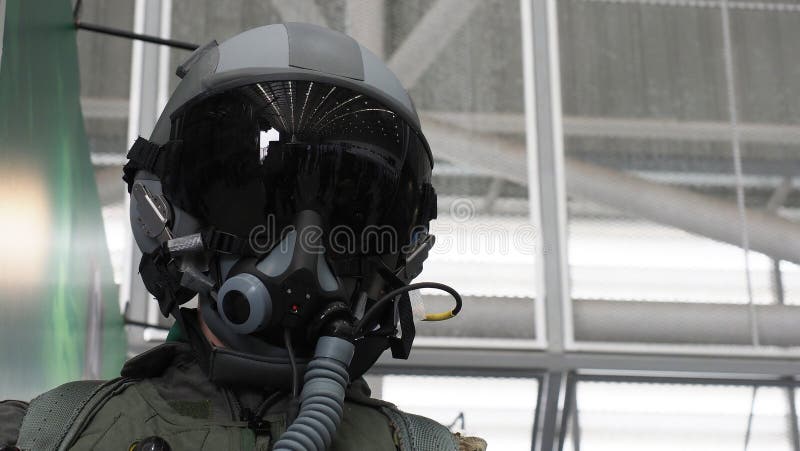 A Fighter Pilot Helmet Equipped with a Dark Visor and Oxygen Mask Stock ...