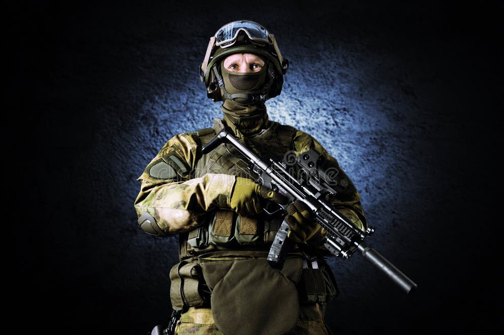 Fighter of a Special Unit is Aiming at the Sight of the Machine Gun ...