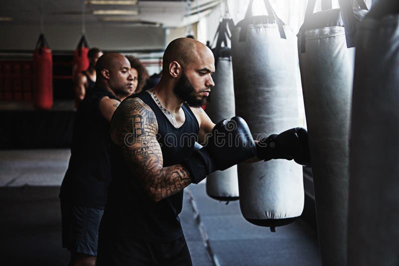 But the Fighter Still Remains. a Kick-boxer Training in a Gym. Stock ...