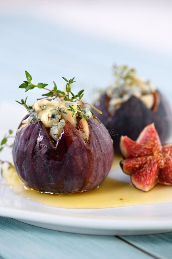 Stuffed Blue Eggplant with Cheese and Eggs Decorated with Cherry ...