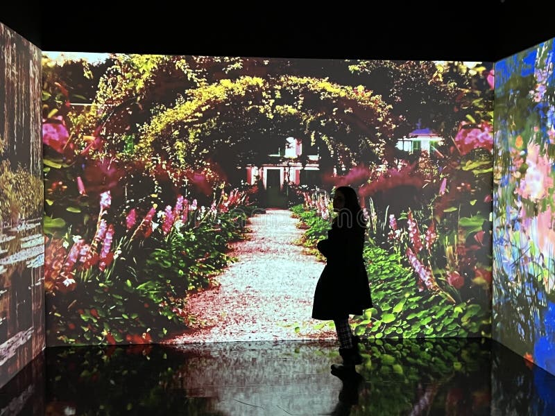 A Figure Against the Light Observes an Image of a Park on a Slide on ...