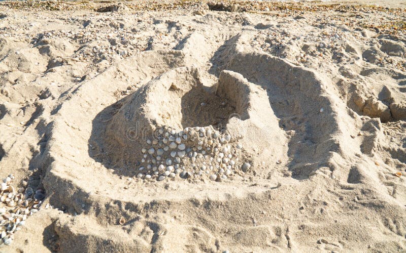 A Figure Built of Sand on the Beach. Stock Image - Image of hill ...