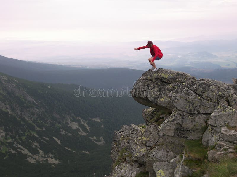 A figure on a cliff stock photo. Image of rocks, figure - 81006494