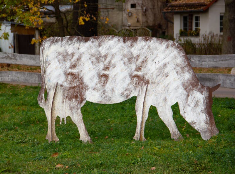 Figure of a Cow Made of Rusty Sheet Iron, Painted White, on a Green ...