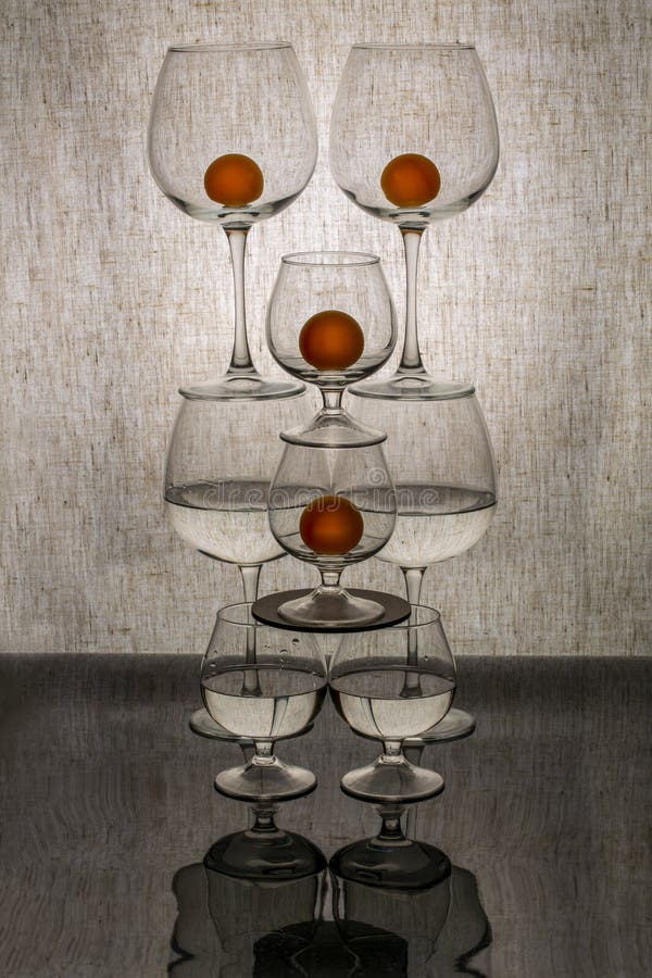 A Figure from Different Glasses with Liquid with Reflection Stock Photo ...