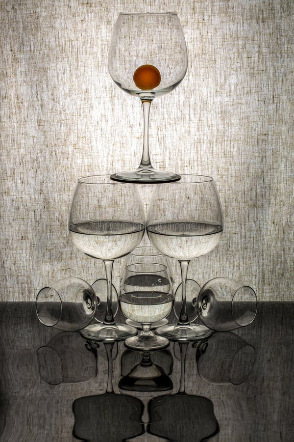 A Figure from Different Glasses with Liquid with Reflection Stock Image ...