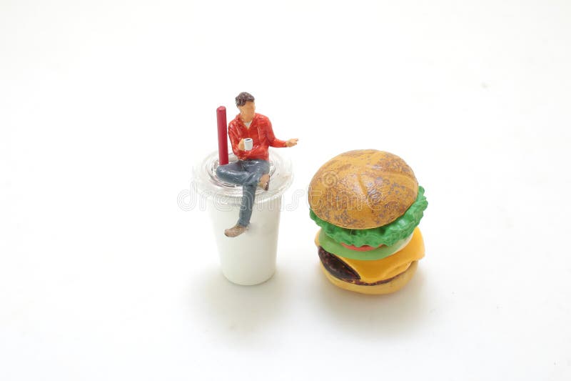 A Figure Drink and Sit on the Paper Cup Stock Image - Image of enjoy ...