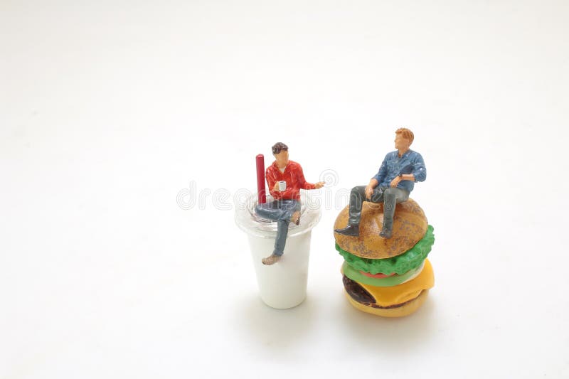 A Figure Drink and Sit on the Paper Cup Stock Photo - Image of person ...