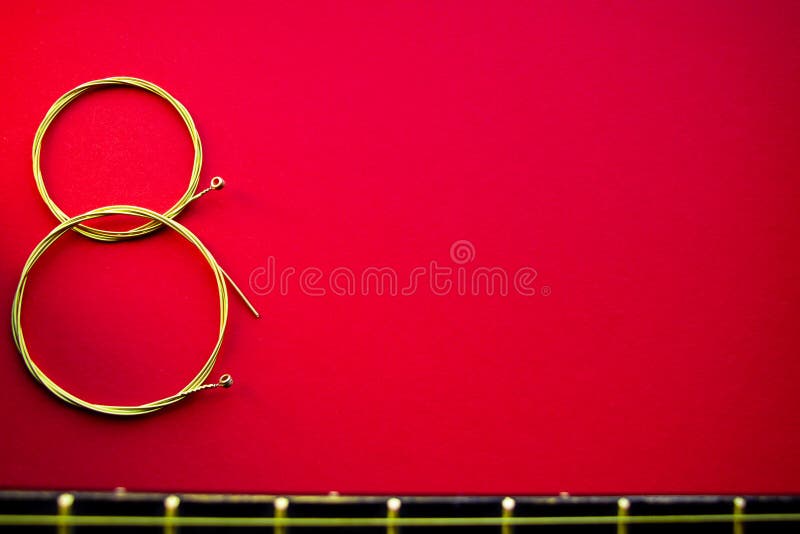 Figure Eight of Guitar Strings on a Red Background. Guitar Neck Stock ...