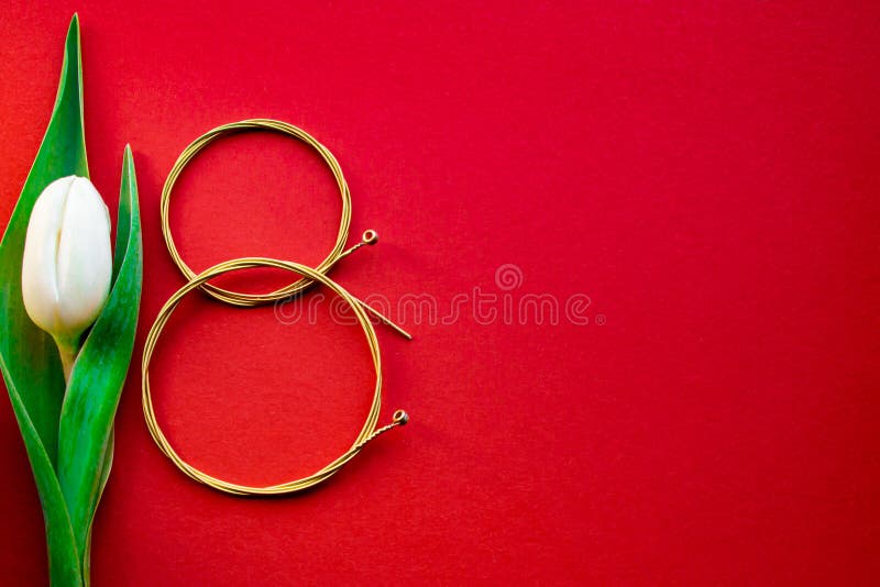 Figure Eight of Guitar Strings on a Red Background. Guitar Neck Stock ...
