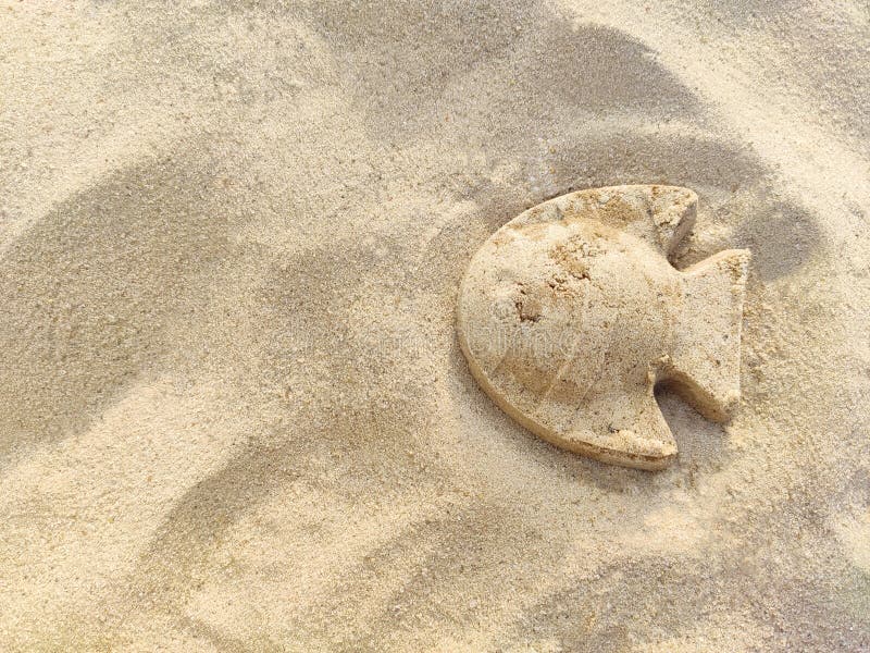 The Figure of a Fish Made of Sand. Close-up Stock Image - Image of ...