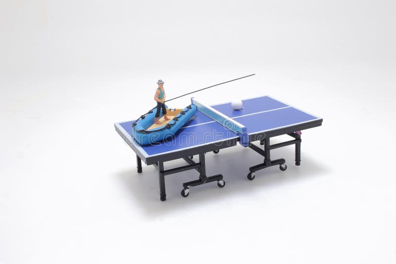 A Figure Fishing on the Ping Pong Table Stock Photo - Image of tennis ...