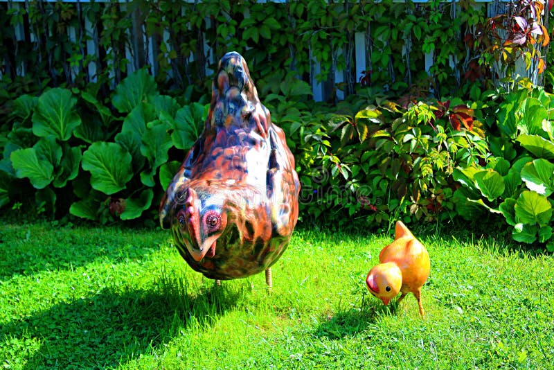 The Figure of the Hen and Chicken on a Green Lawn Stock Photo - Image ...