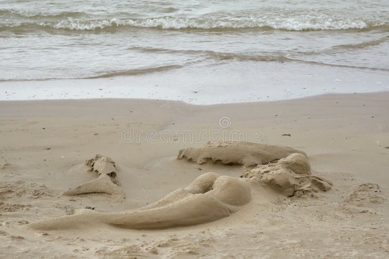 Figure Mermaid Out of the Sand on the Beach Stock Image - Image of ...