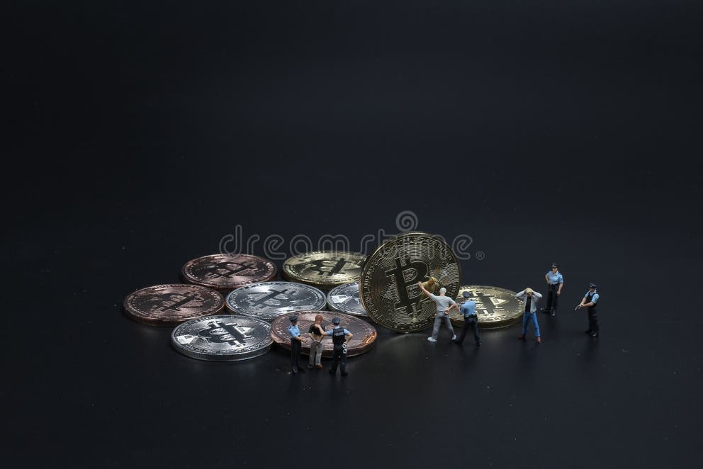 A Figure Police Catch the Hacker with Bitcoins Stock Photo - Image of ...