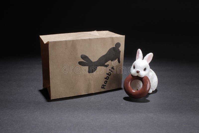 A Figure of Rabbit Steal the Chocolate Donut Stock Photo - Image of ...