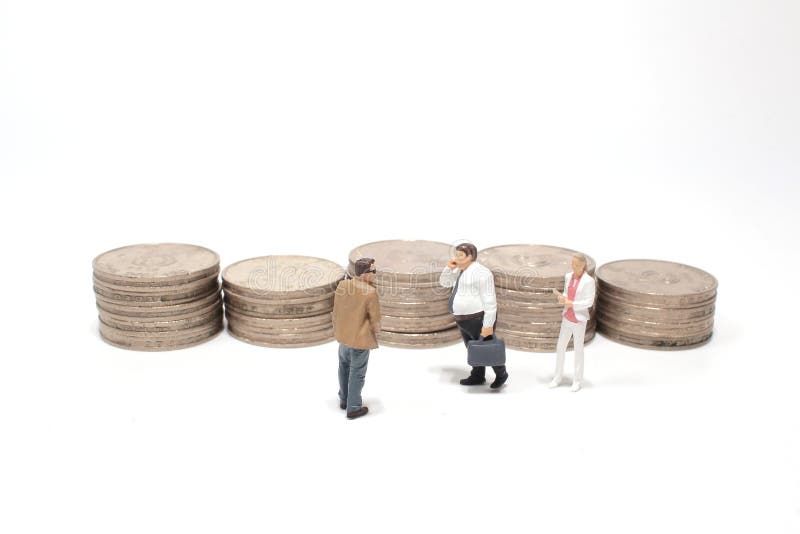 A Figure Stand with Stack of Silver Coin on White Background Stock ...