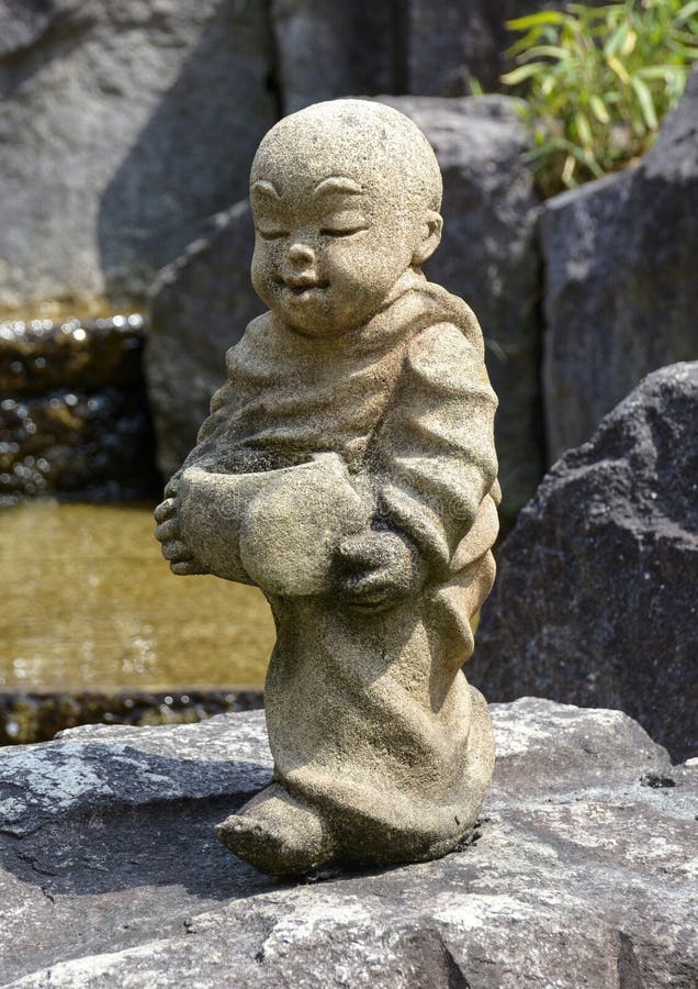 Figure in Stone of Japan stock image. Image of protect - 317783017