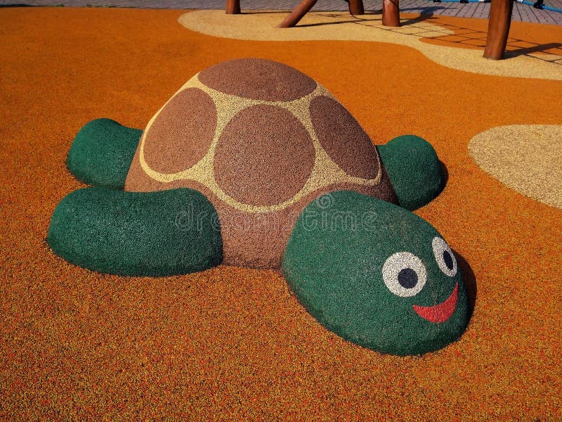 The Figure of a Turtle on the Playground Made of Soft Rubber Crumbs in ...