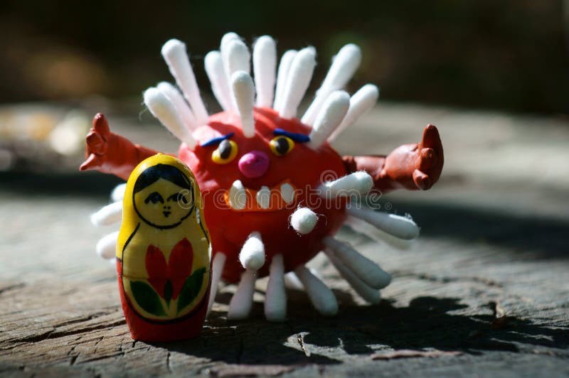 The Figure of the Virus from Clay. Next To a Small Matryoshka Stock ...