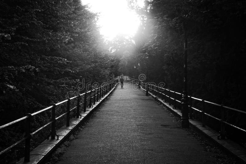 Figure Walking into the Distance Stock Image - Image of background ...