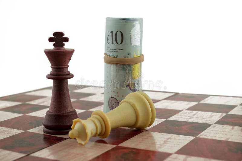 Figures of Chess on Chessboard and English Money Pounds Stock Photo ...
