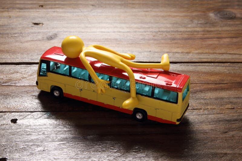 Figure Lying Top of Toy Bus Stock Photo - Image of rustic, wooden ...